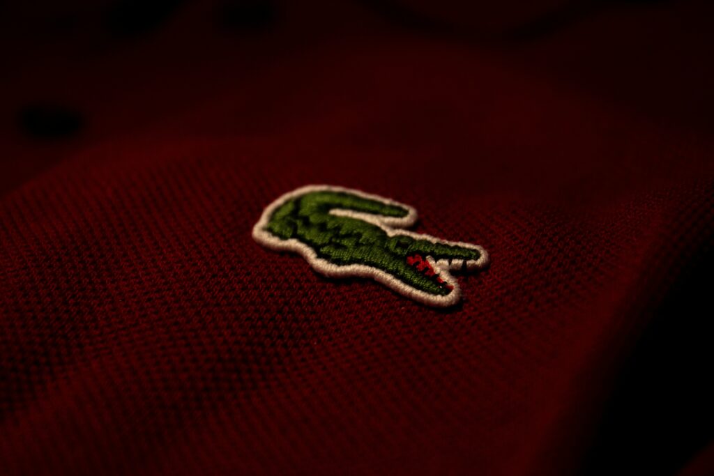 Lacoste Logo: Meaning, History, Design Influences, and Evolution - Boon ...