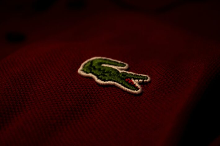 Lacoste Logo: Meaning, History, Design Influences, and Evolution - Boon ...