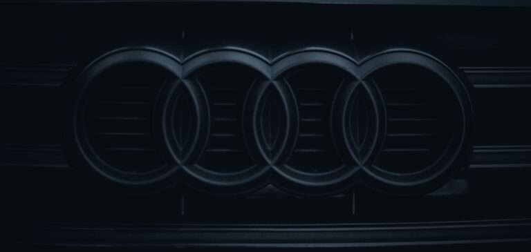 Audi Logo: Meaning, History, Design Influences, and Evolution - Boon ...