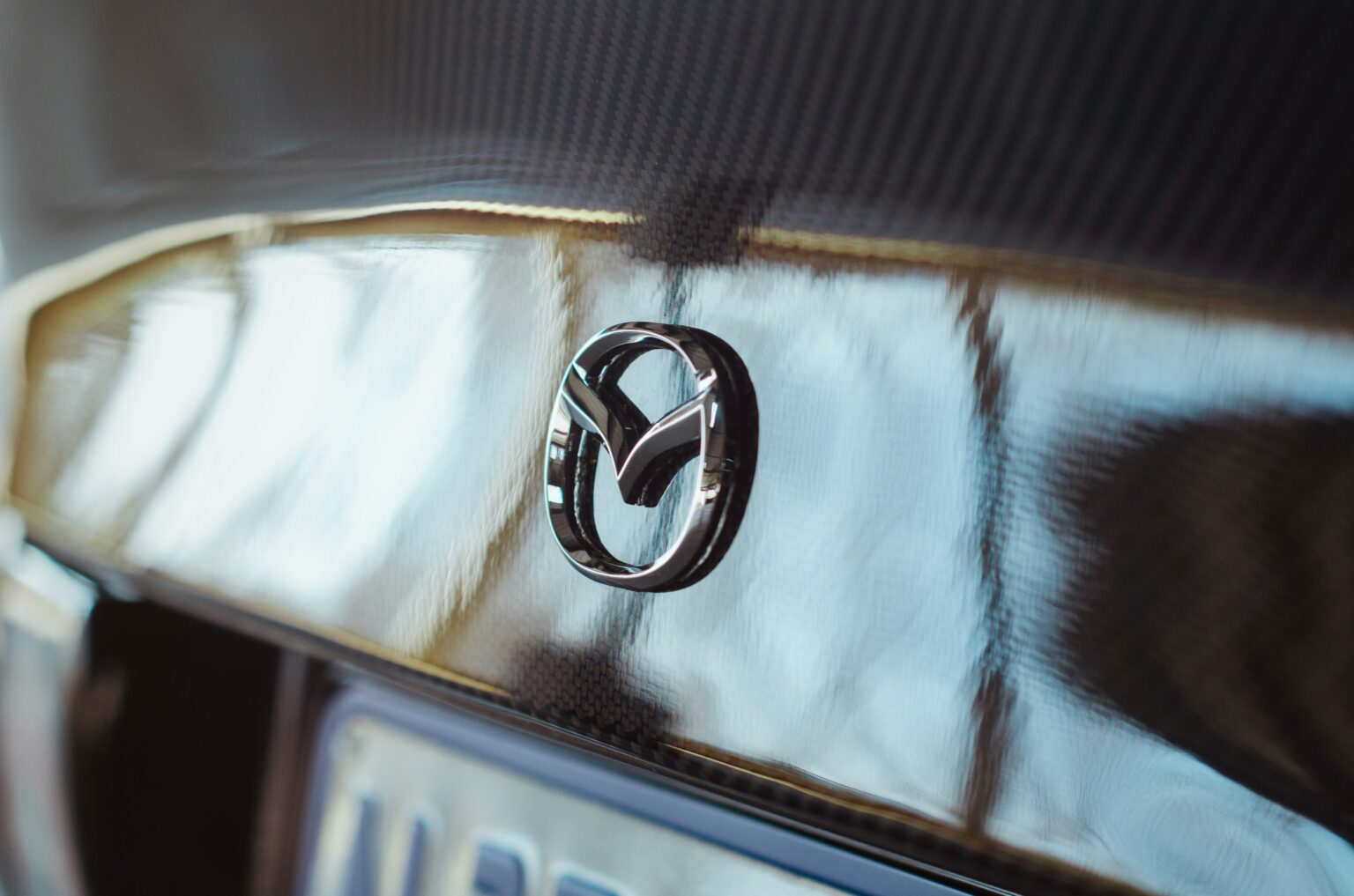 Mazda Logo: Meaning, History, Design Influences, and Evolution - Boon ...