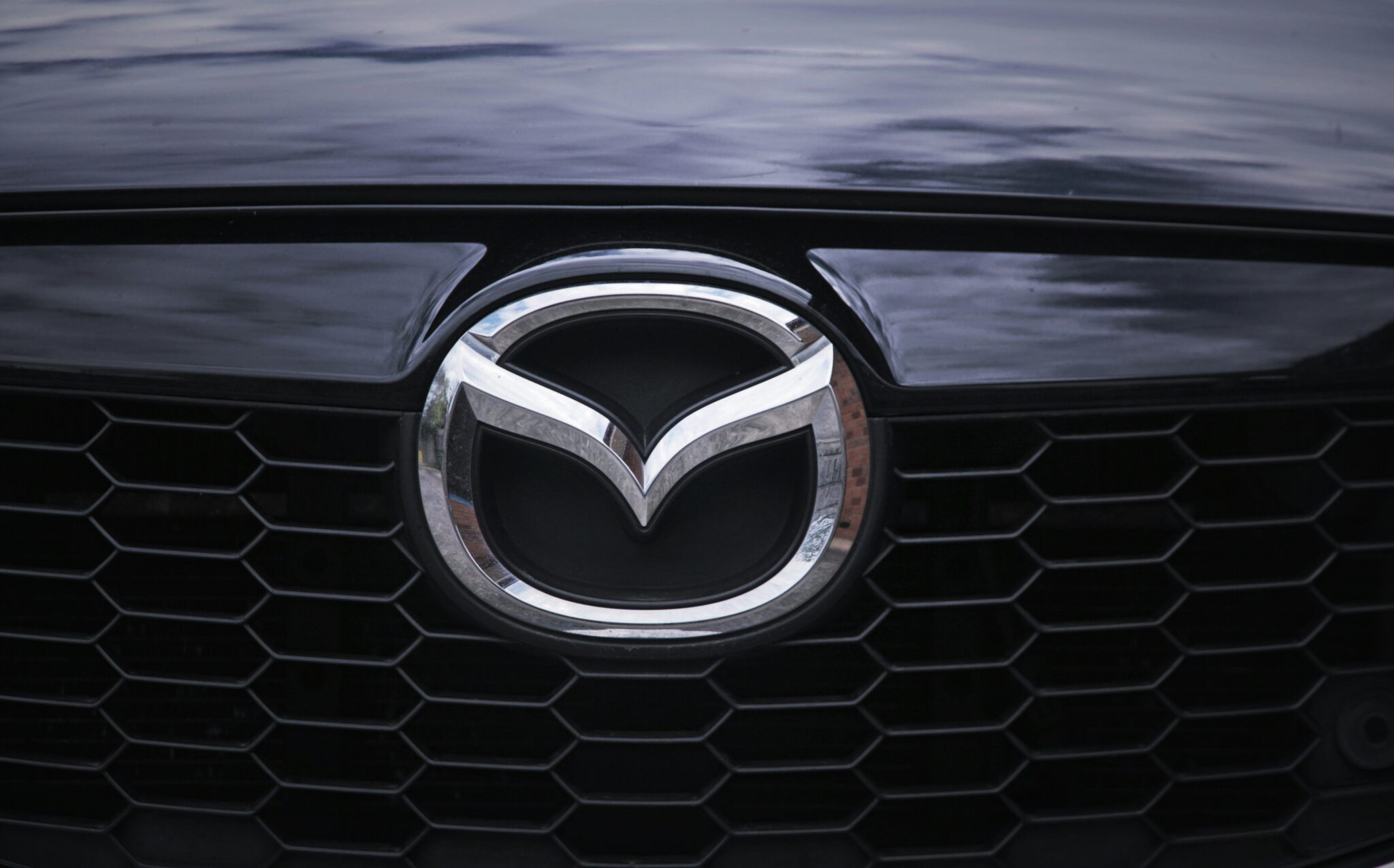 Mazda Logo: Meaning, History, Design Influences, and Evolution - Boon ...