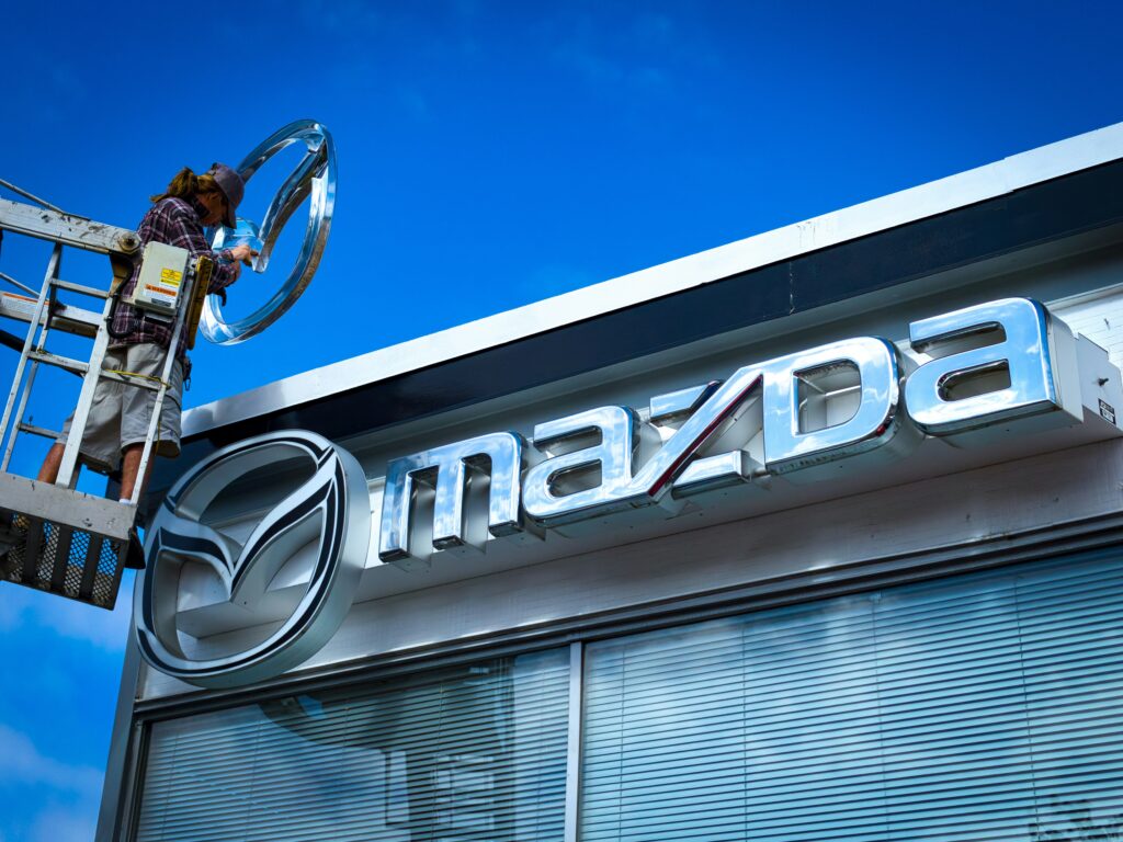 Mazda Logo: Meaning, History, Design Influences, and Evolution - Boon ...