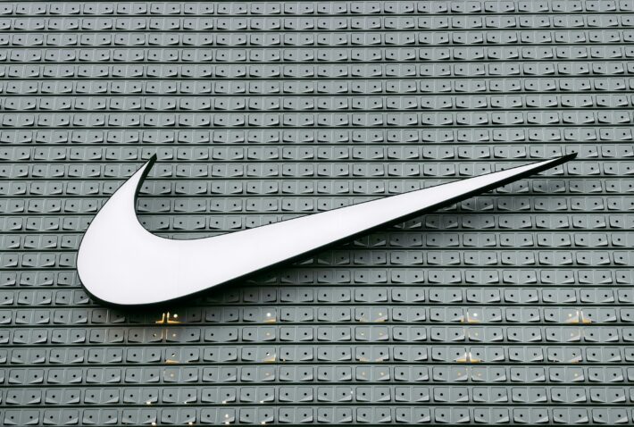 Nike Logo: Meaning, History, Design Influences, and Evolution - Boon ...