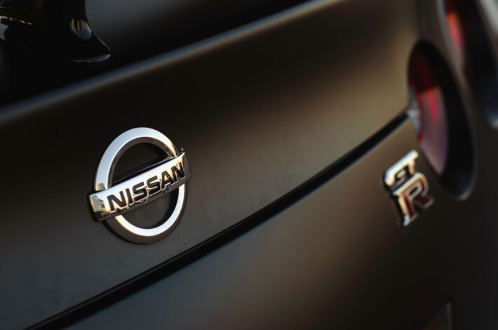 Nissan Logo: Meaning, History, Design Influences, and Evolution - Boon ...