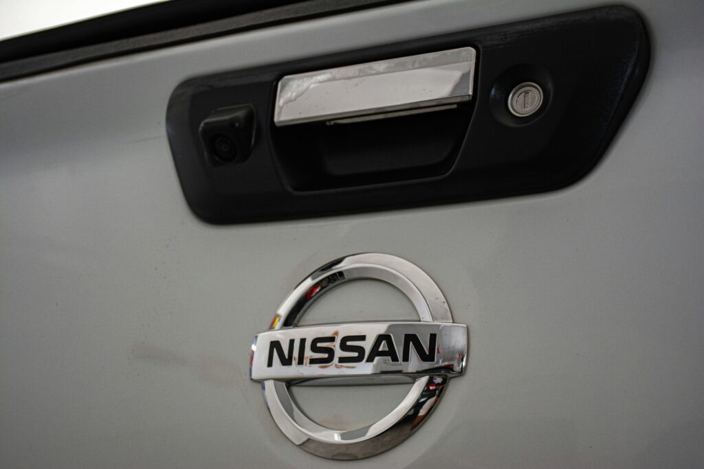 Nissan Logo: Meaning, History, Design Influences, and Evolution - Boon ...