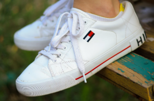 Tommy Hilfiger Logo: Meaning, History, Design Influences, and Evolution ...